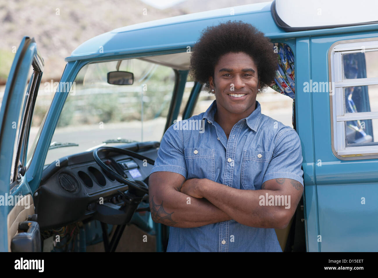 Portrait of man standing at van Stock Photo - Alamy