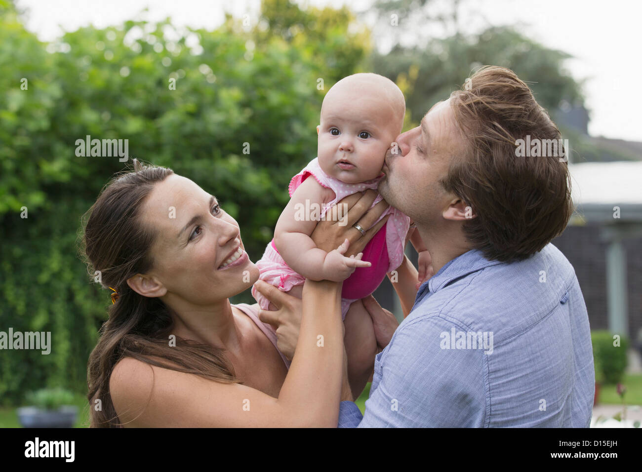 Netherlands, Mijnsheerenland, Family with baby daughter (6-11 months ...