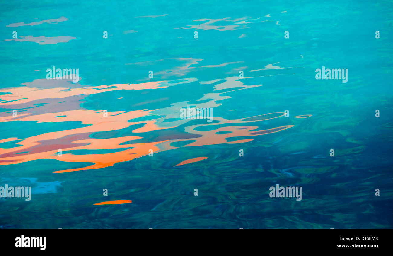 Orange reflection on water surface Stock Photo - Alamy