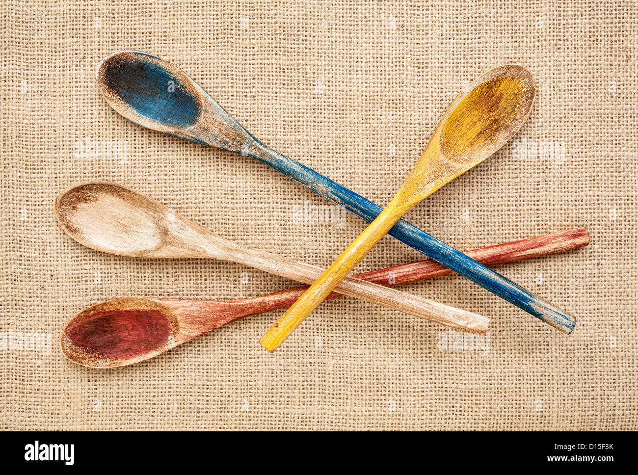 rustic wooden painted spoons on burlap canvas Stock Photo - Alamy