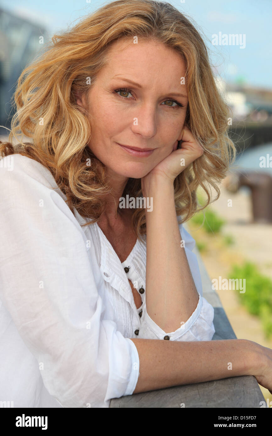 Serious woman outside in the sunshine Stock Photo - Alamy