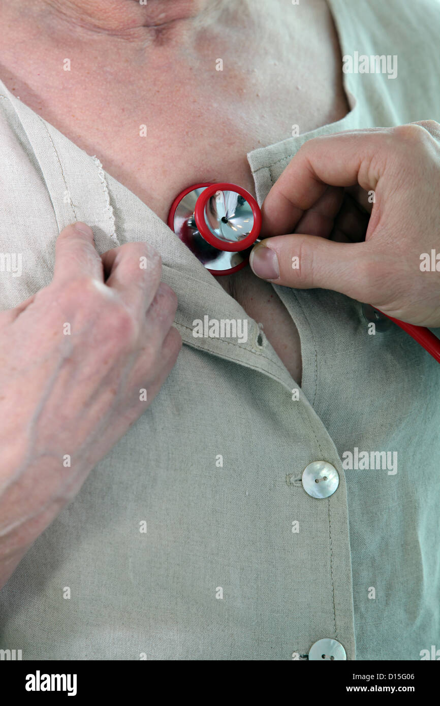 Doctor using stethoscope Stock Photo - Alamy