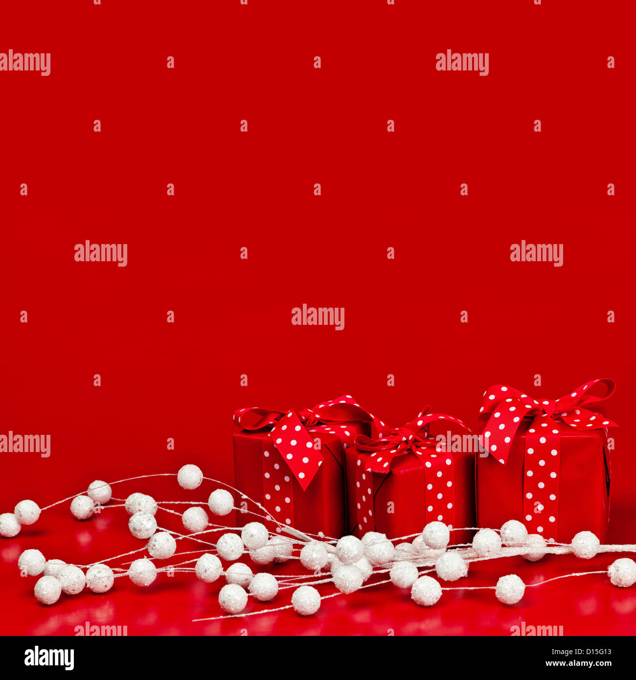 Red Christmas background with wrapped presents and decorations Stock ...