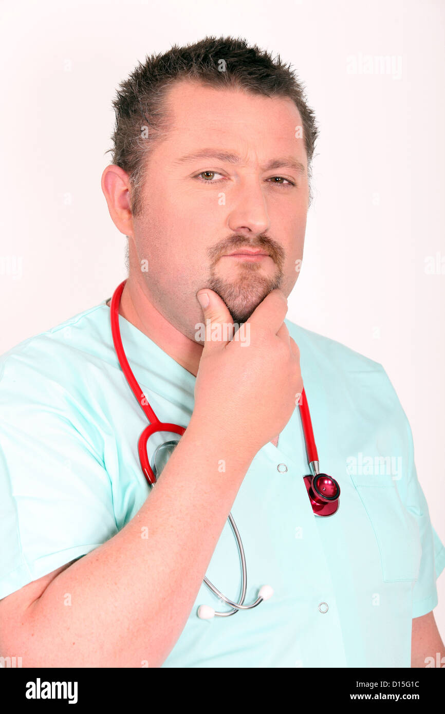 A doctor scratching his chin Stock Photo - Alamy