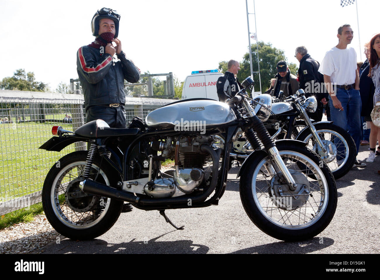 A man with his classic custom Cafe Racer motorbike at a car show Stock ...