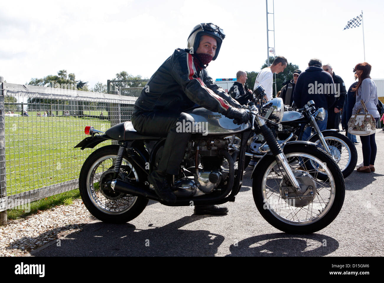 A man with his classic custom Cafe Racer motorbike at a car show Stock ...