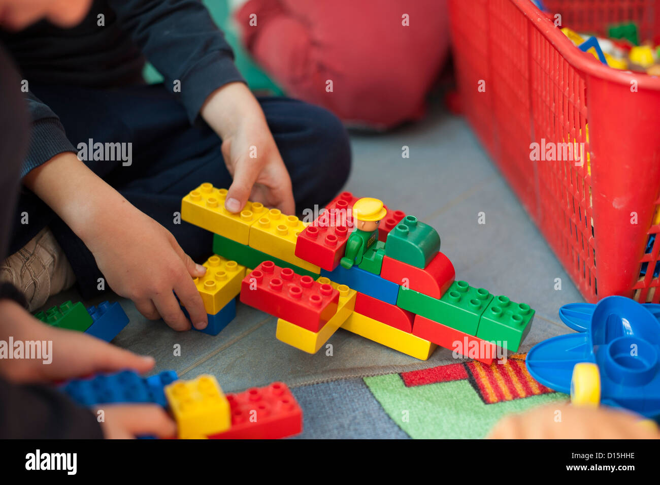 hands of a child playing with building blocks Stock Photo - Alamy