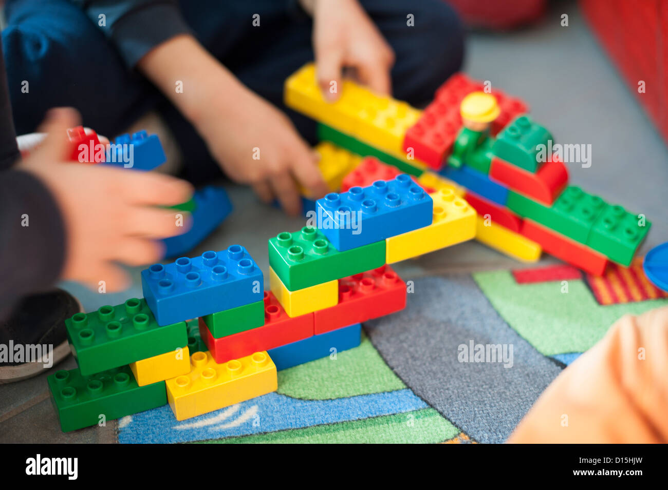 hands of a child playing with building blocks Stock Photo - Alamy