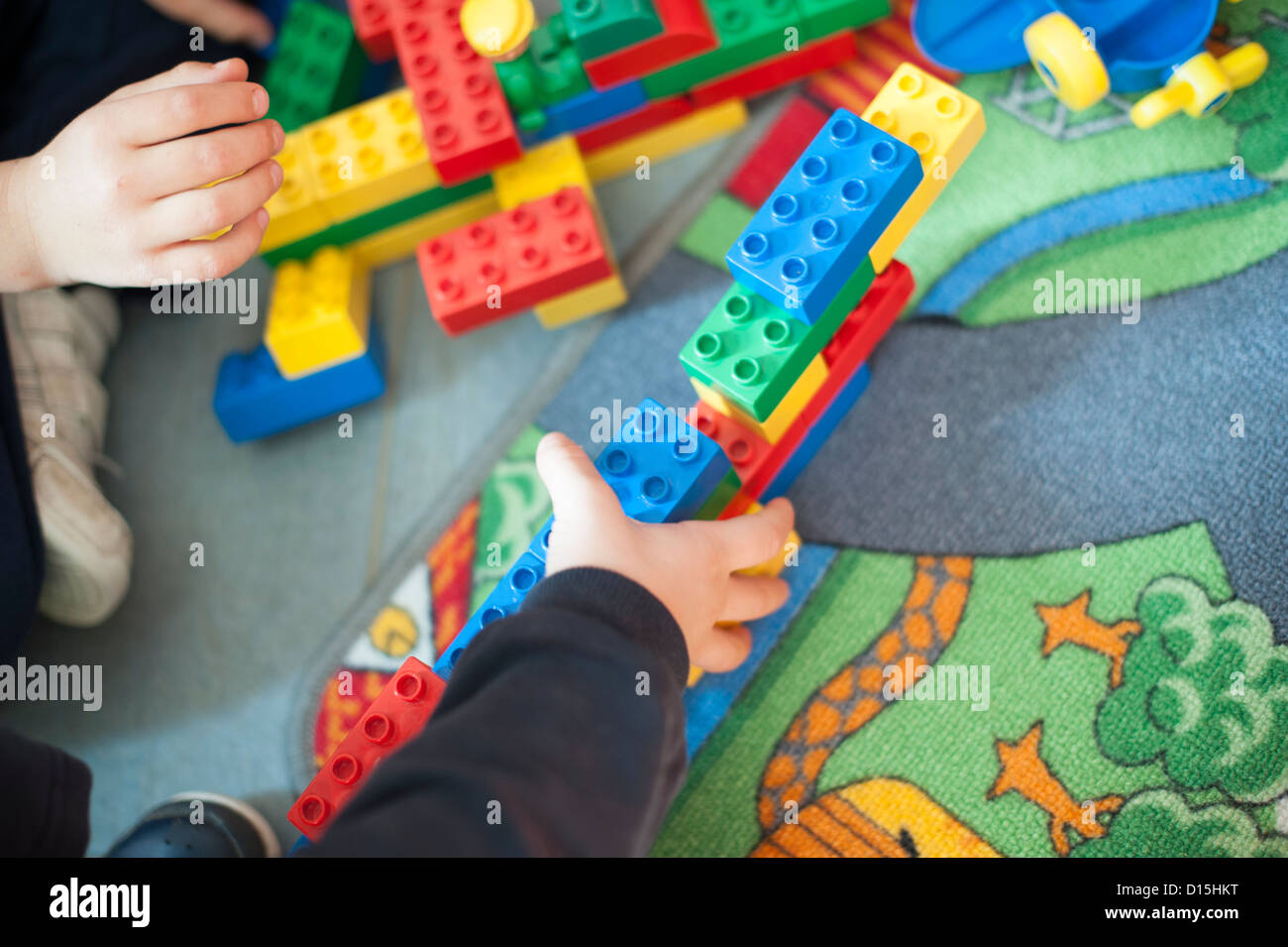 hands of a child playing with building blocks Stock Photo - Alamy