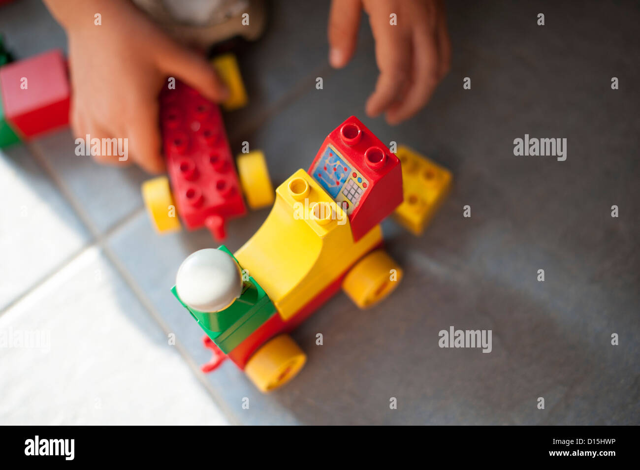 hands of a child playing with building blocks Stock Photo - Alamy