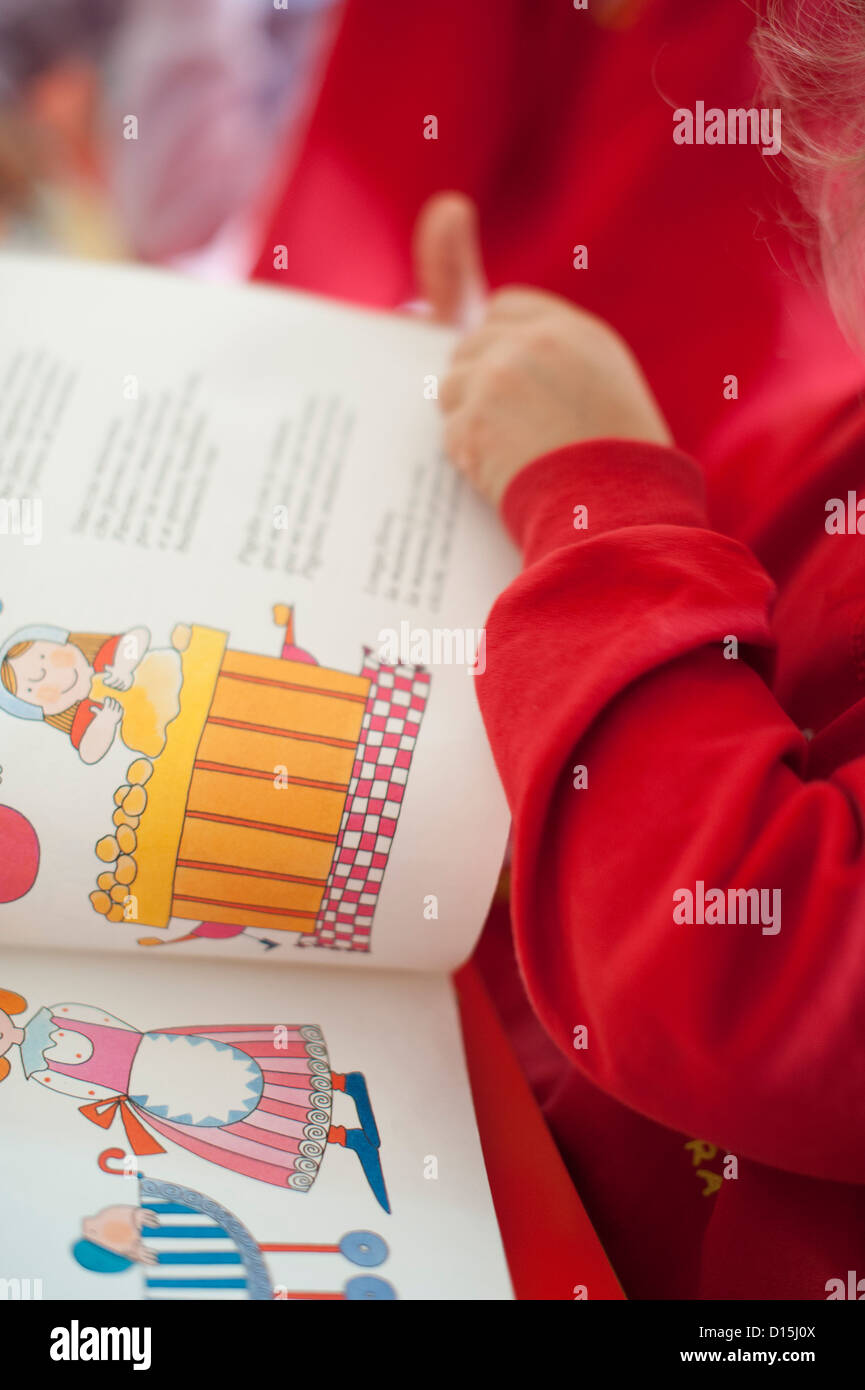 Hands of child and book Stock Photo - Alamy