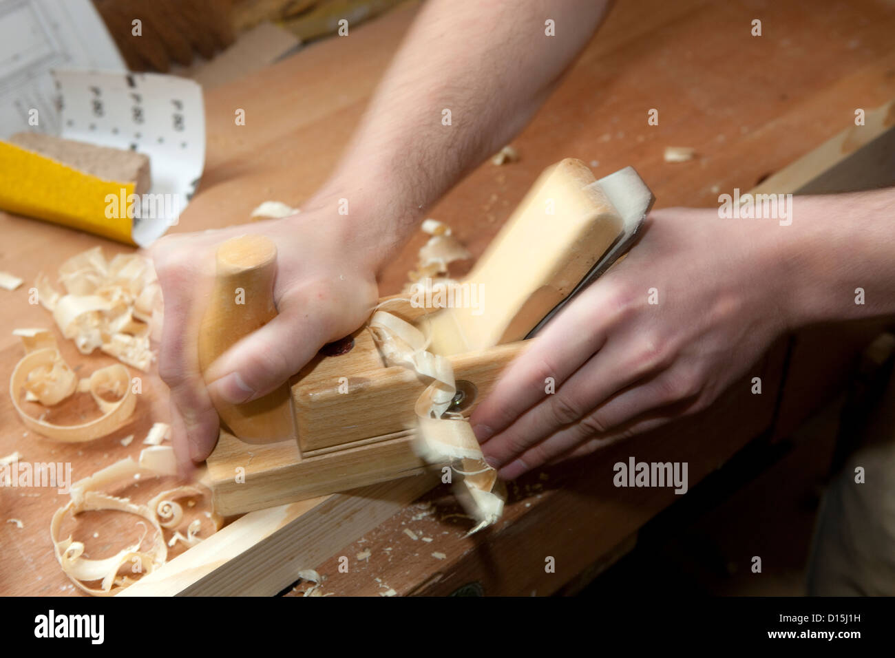 Duesseldorf, Germany, a carpenter working on a piece of wood with a ...