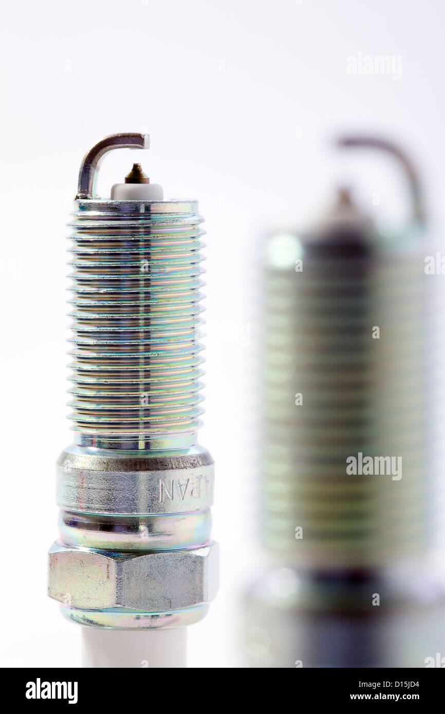 Close up of a spark plugs isolated on white background Stock Photo - Alamy