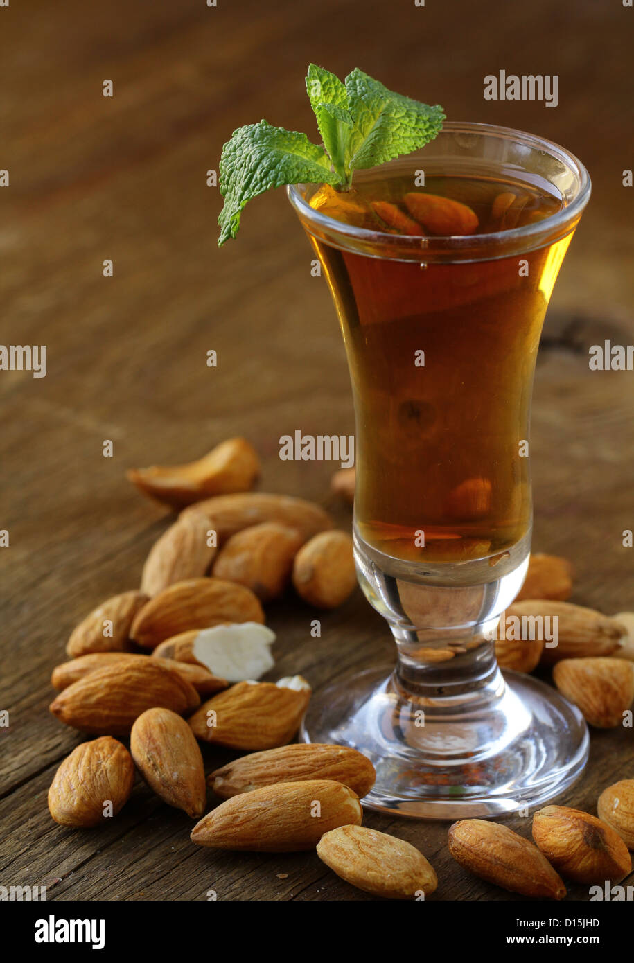 Almond liquor amaretto with whole nuts Stock Photo - Alamy