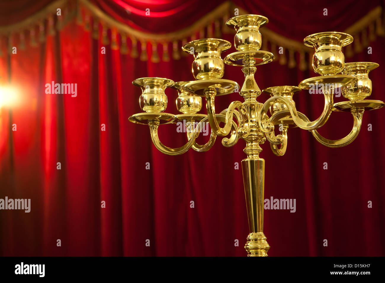 Antique candelabra with red background Stock Photo - Alamy