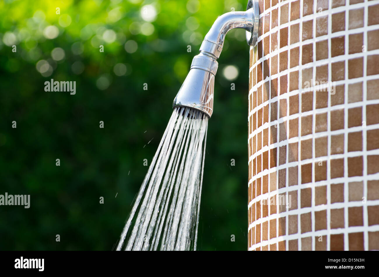 Tropical refreshing shower under palm trees Stock Photo - Alamy