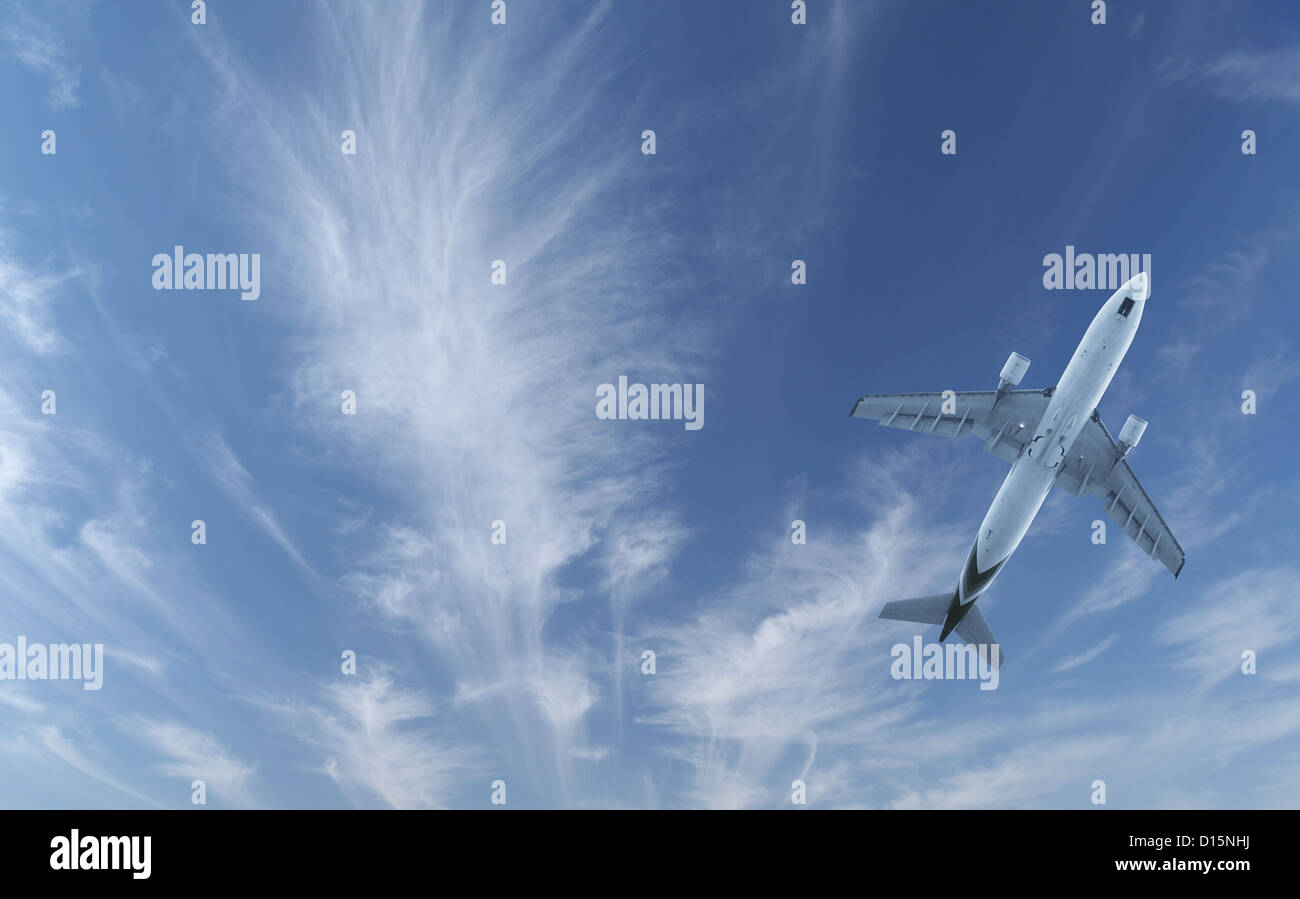 The Airliner flying in the blue sky with cirrus clouds Stock Photo - Alamy