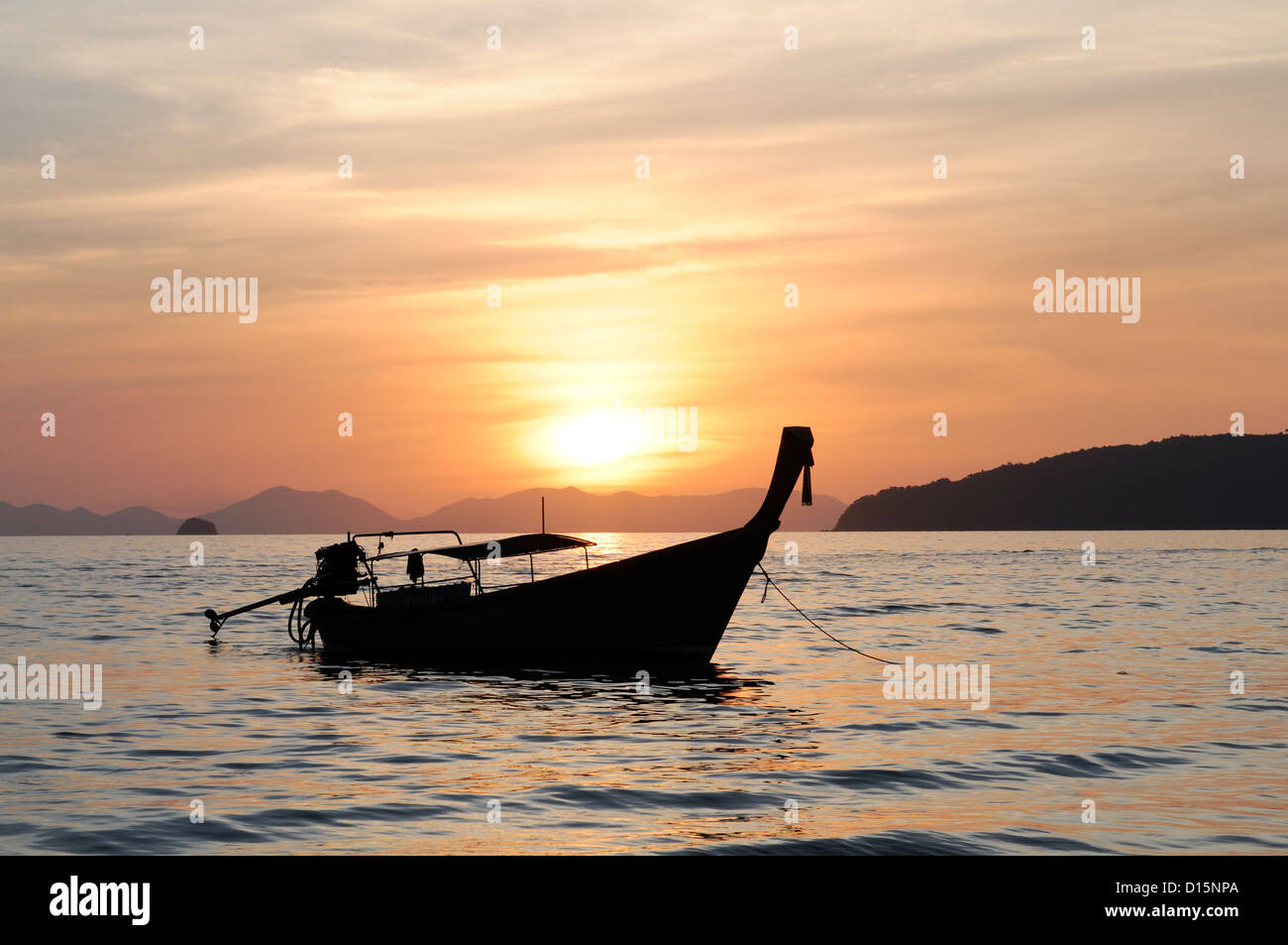 Longtail boats seashore sunset Ao Nang beach Krabi Thailand traditional thai fishing boat ...