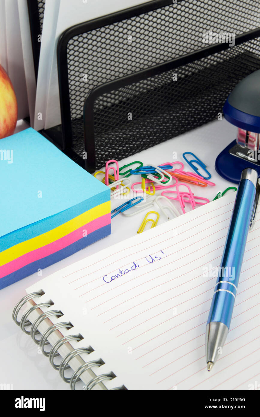 Contact us caption on notepad hi-res stock photography and images - Alamy