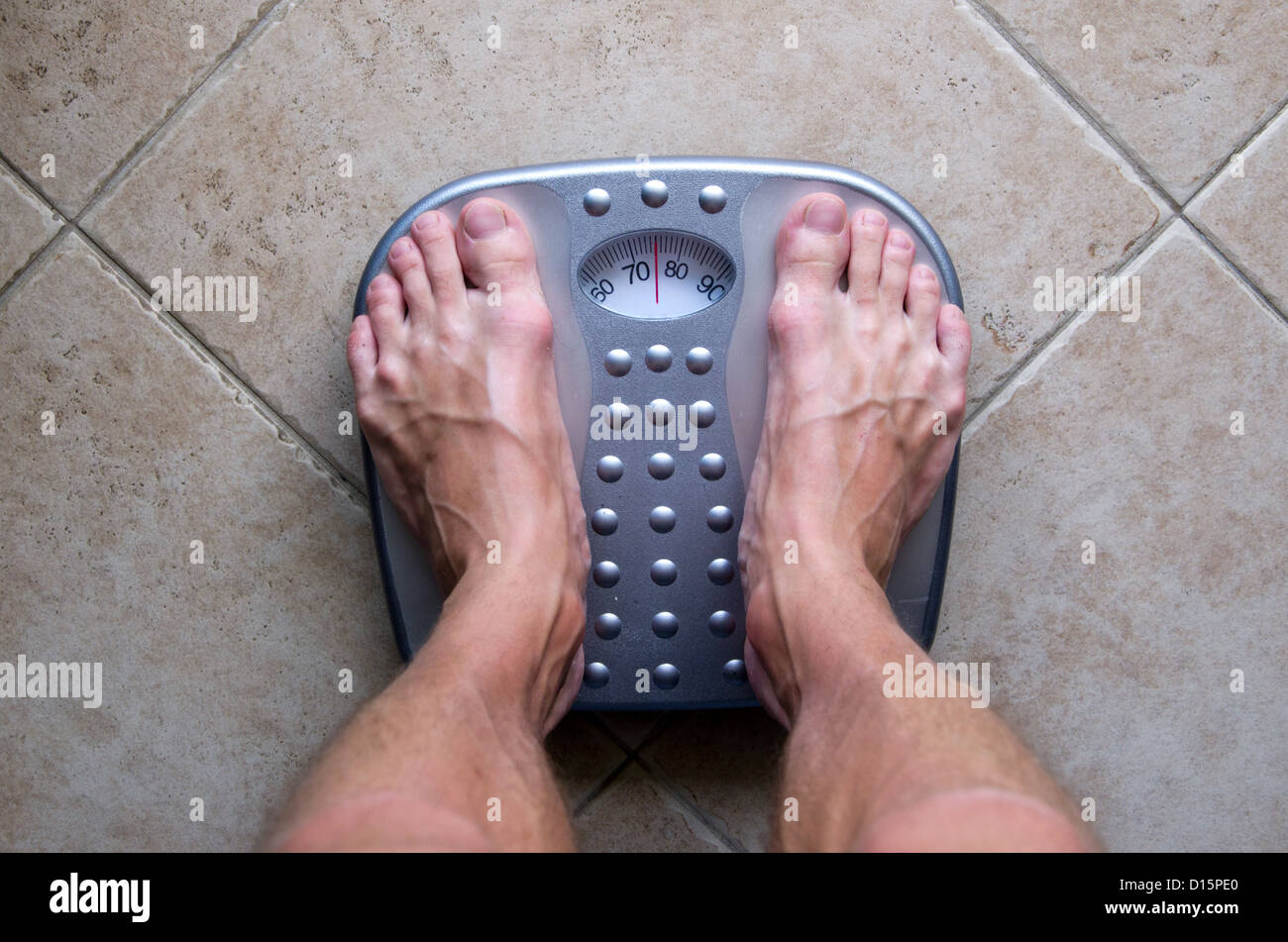 Feet on a weighing scale Stock Photo - Alamy