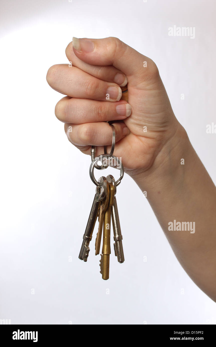 close up of a hand holding a bunch of keys Stock Photo - Alamy