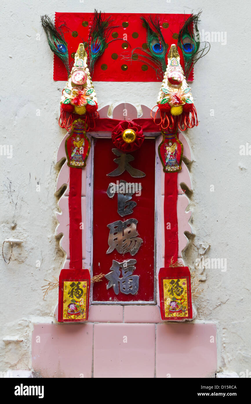 Little Shrine on a Wall in Ho Chi Minh City, Vietnam Stock Photo - Alamy