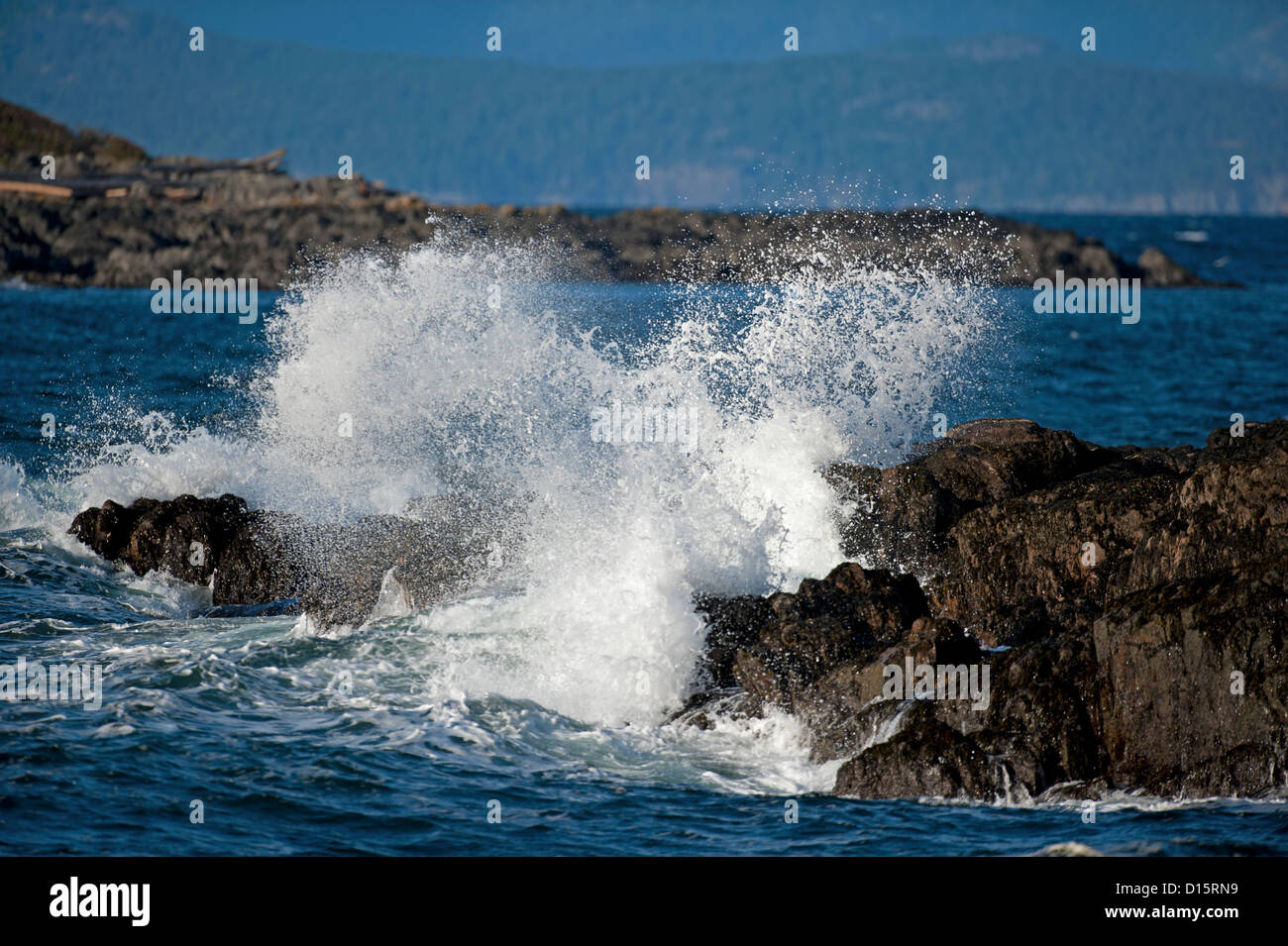 Wave splash on rocks, Beachcomber Park, Georgia Strait. British ...