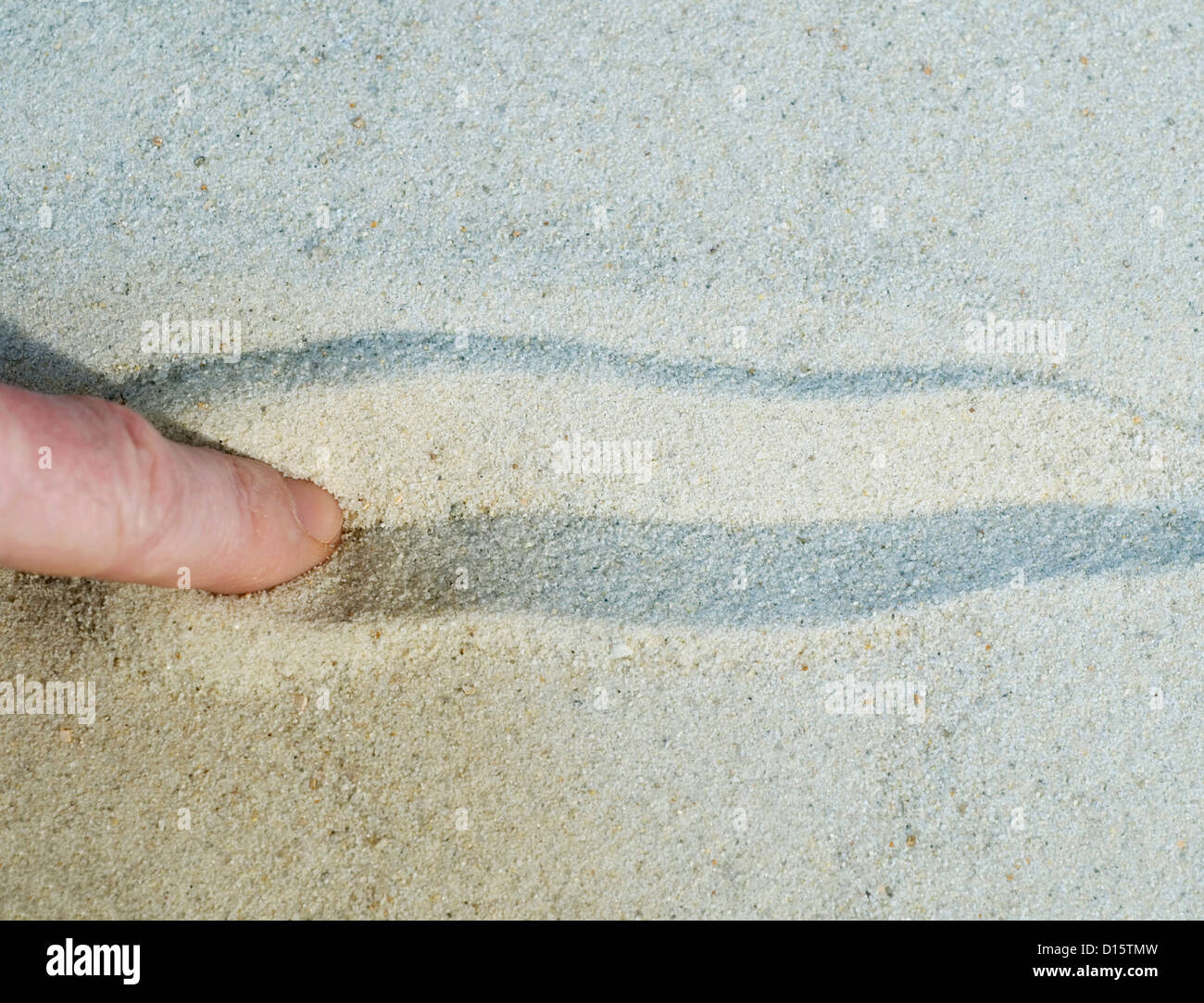 line on sand and finger Stock Photo - Alamy