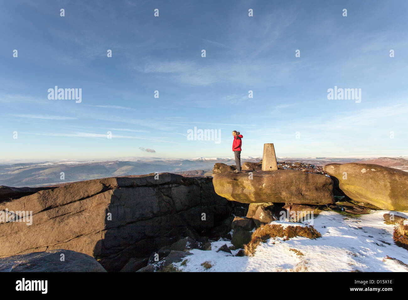 The Peak District National Park. Stanage Edge in winter with a male ...