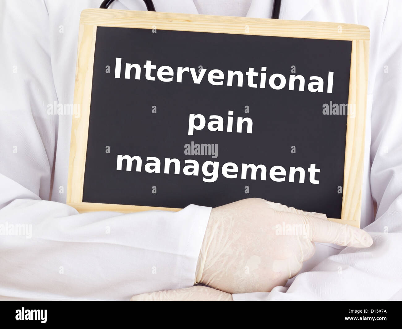 Doctor shows information: interventional pain management Stock Photo ...