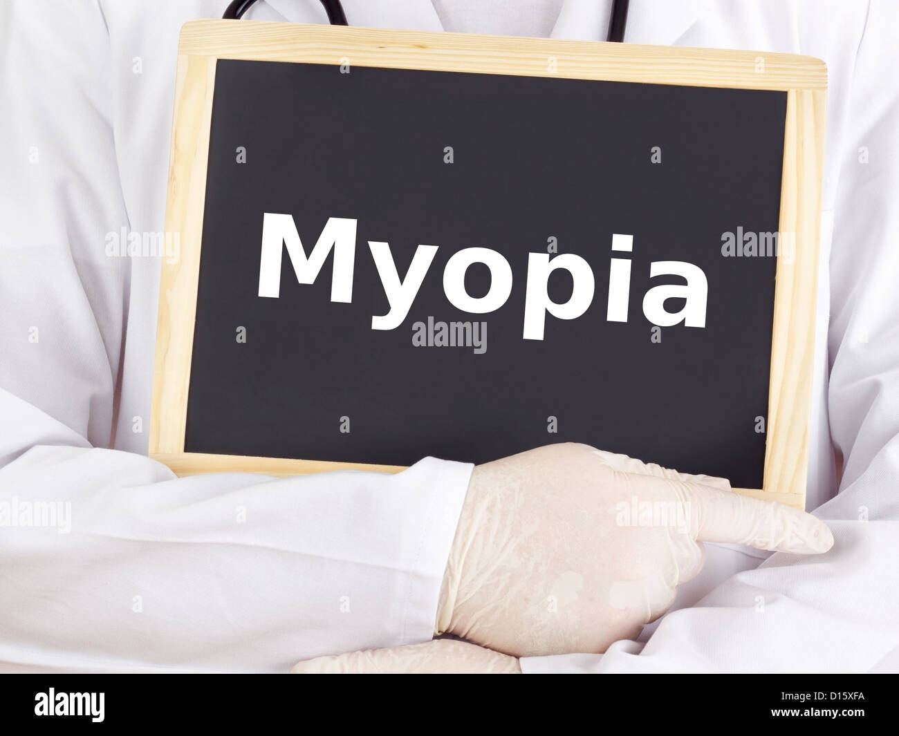Doctor shows information on blackboard: myopia Stock Photo - Alamy