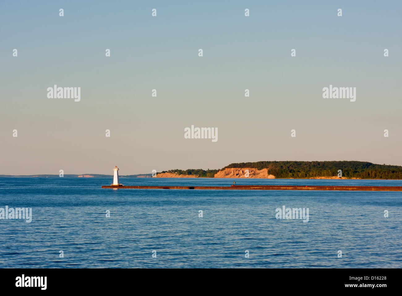 Sodus Bay Lighthouse on Lake Ontario in evening sunlight just before ...