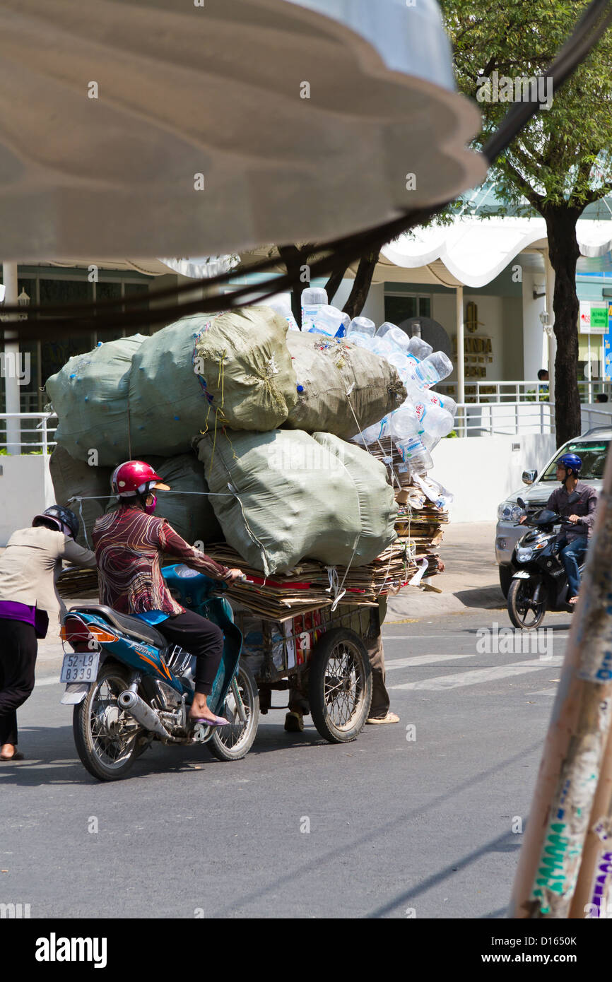Overloaded Tricycle in the Streets of Ho Chi Minh City, Vietnam Stock ...