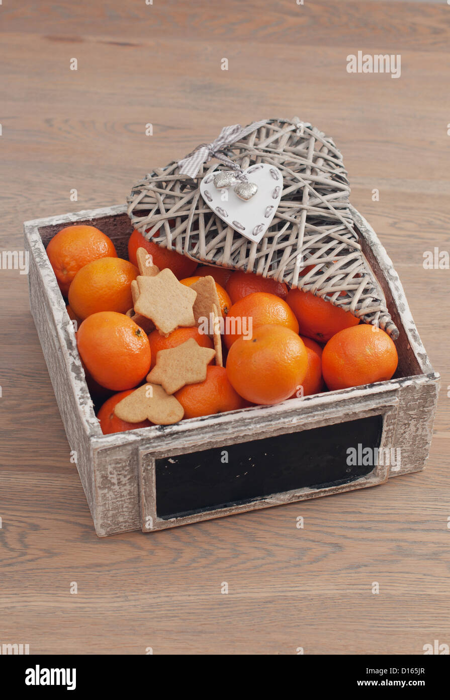 The full box of mandarins, gingerbread with decorative heart on the top ...
