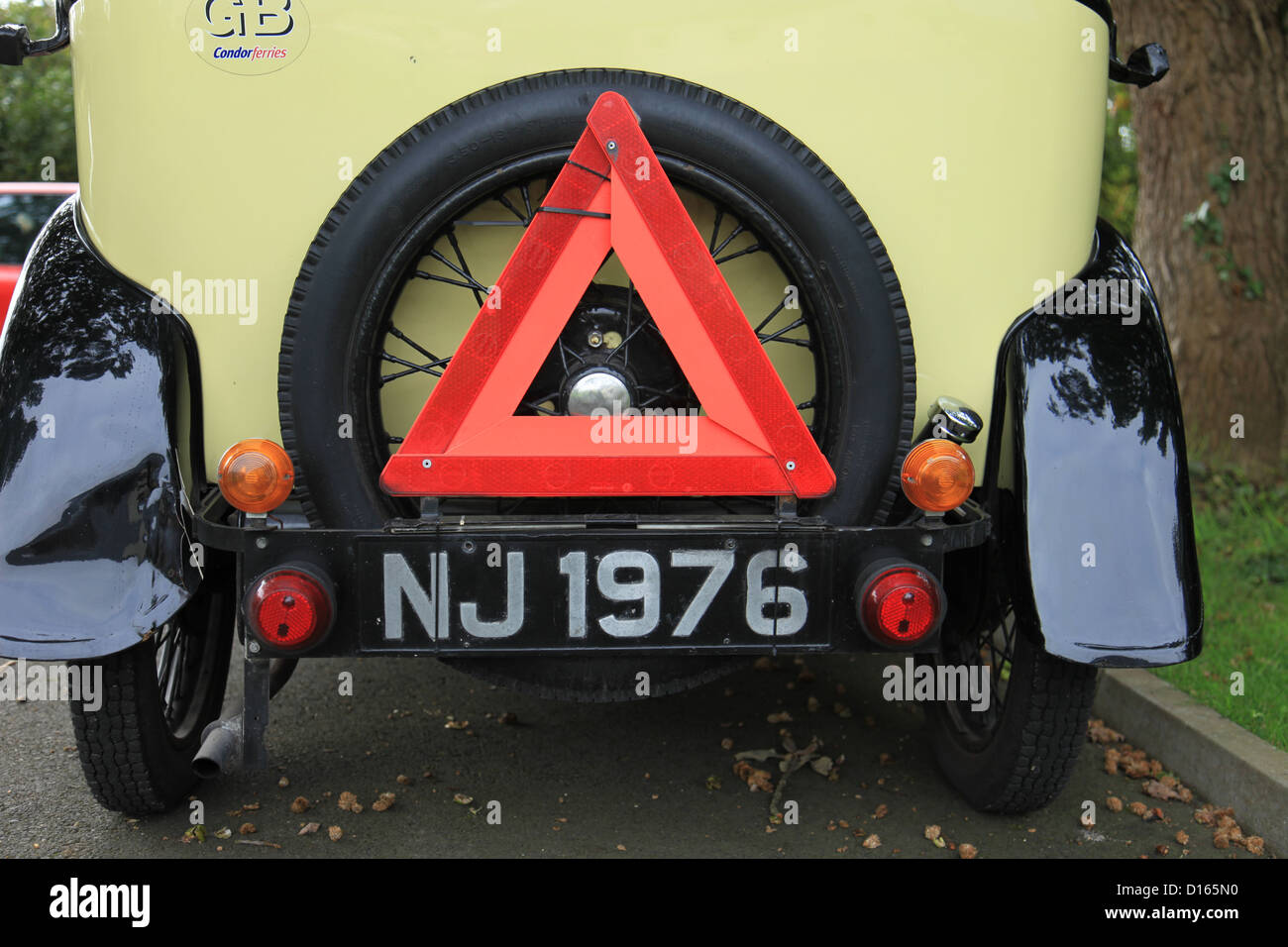 rear view of an old english classic four wheeled petrol driven vintage ...