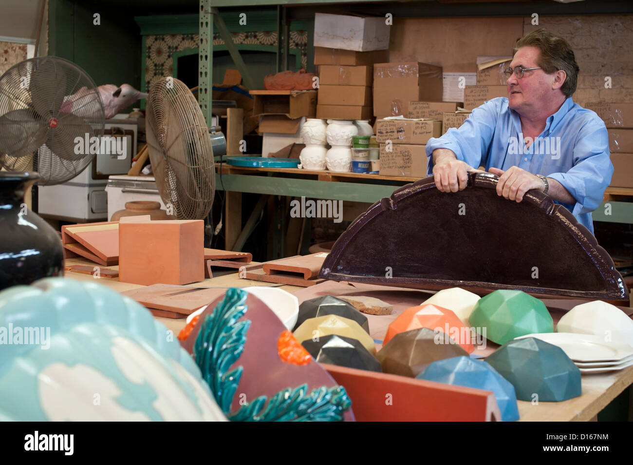 Worker in a clay tile factory,LA Stock Photo - Alamy