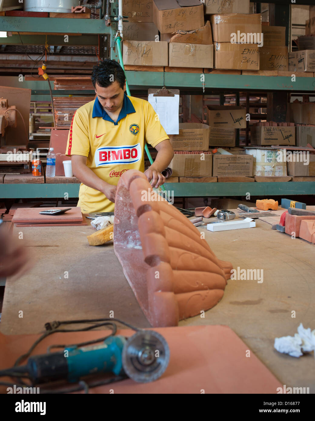 Worker in a clay tile factory,LA Stock Photo - Alamy