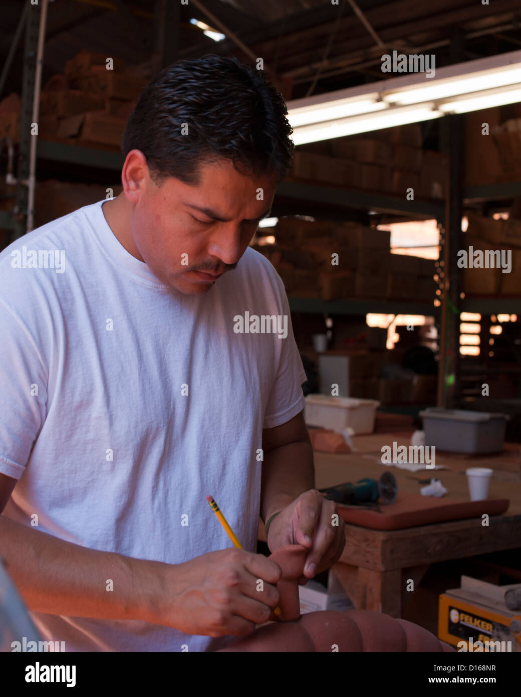 Worker in a clay tile factory,LA Stock Photo - Alamy