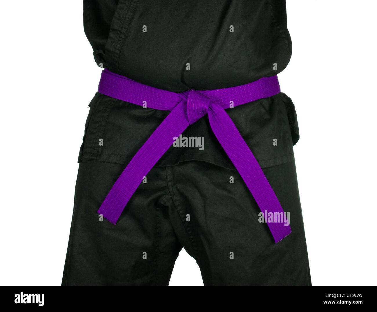 Karate purple belt tied around marital artists torso wearing black dojo ...