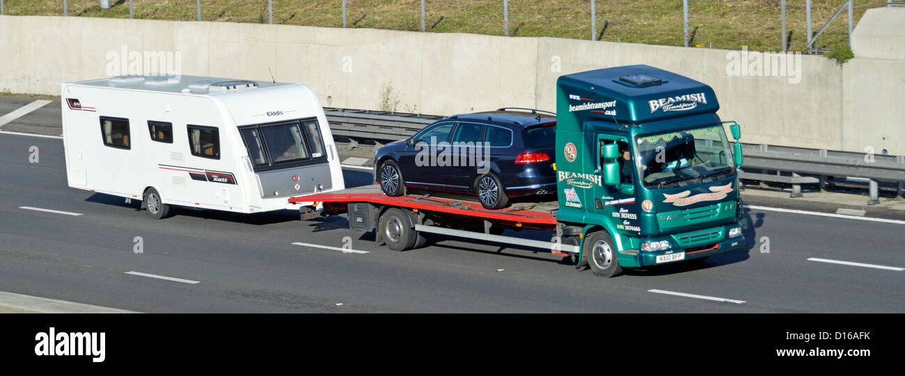specialist car caravan transporting vehicle on motorway Stock Photo - Alamy