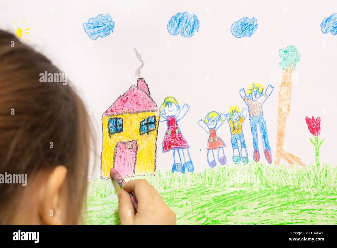 Girl draws her own house and happy family Stock Photo - Alamy