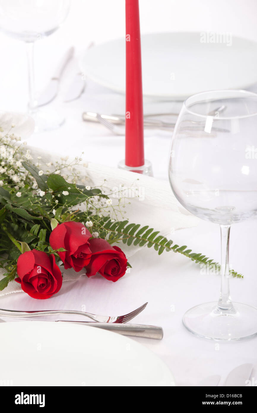 Romantic table setting with rose and cutlery Stock Photo - Alamy