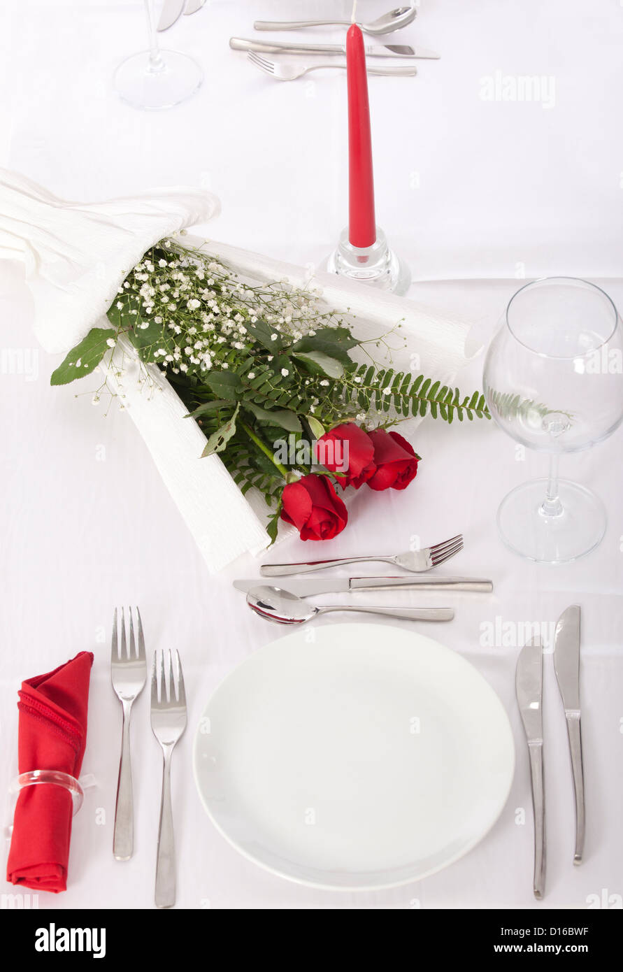 Romantic table setting with rose and cutlery Stock Photo - Alamy
