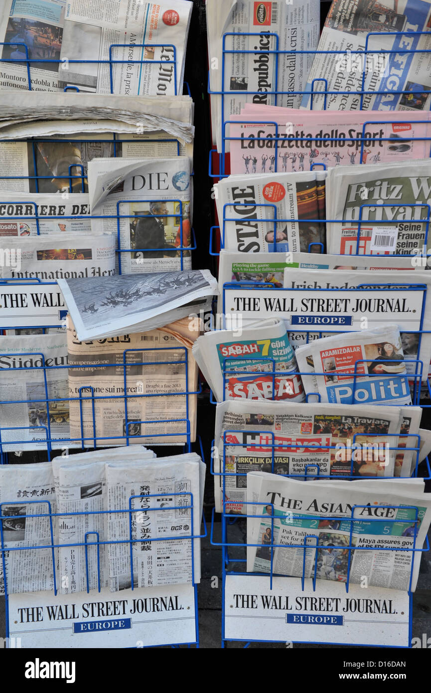 Newspaper display outside a newsagents on street showing a variety of ...