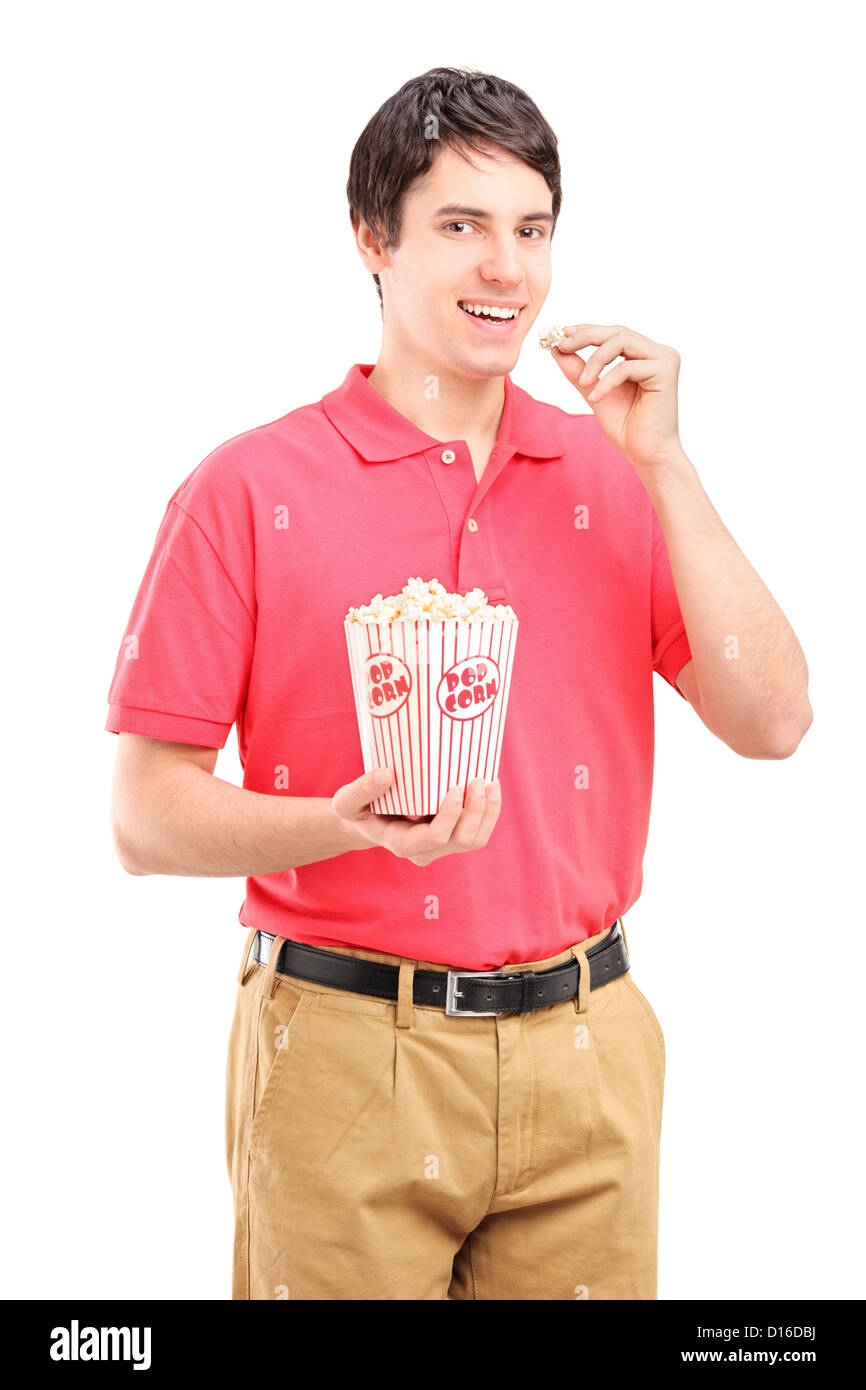 Young smiling man eating popcorn isolated on white background Stock ...