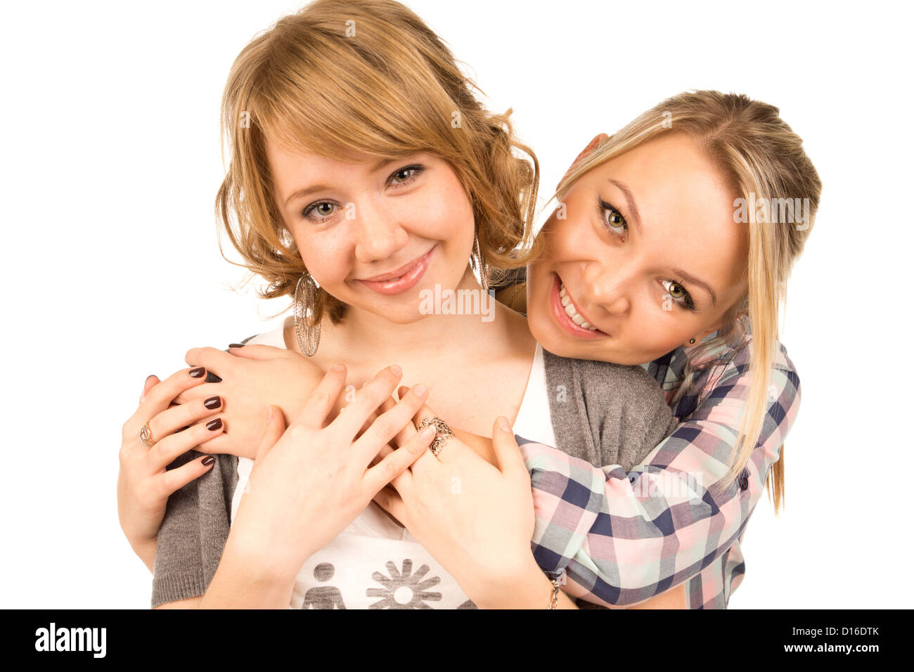 Affectionate girls in intimate embrace with beautiful smiles posing with their arms around each ...