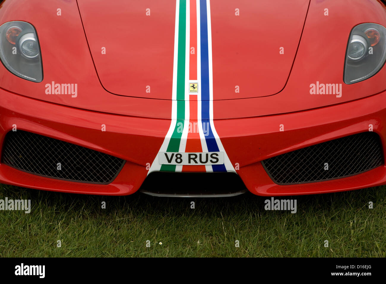 A tricolor stripe on the front of a red Ferrari supercar Stock Photo ...