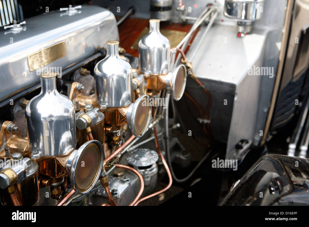 Triple SU carburetters on an old chrome engine Stock Photo - Alamy