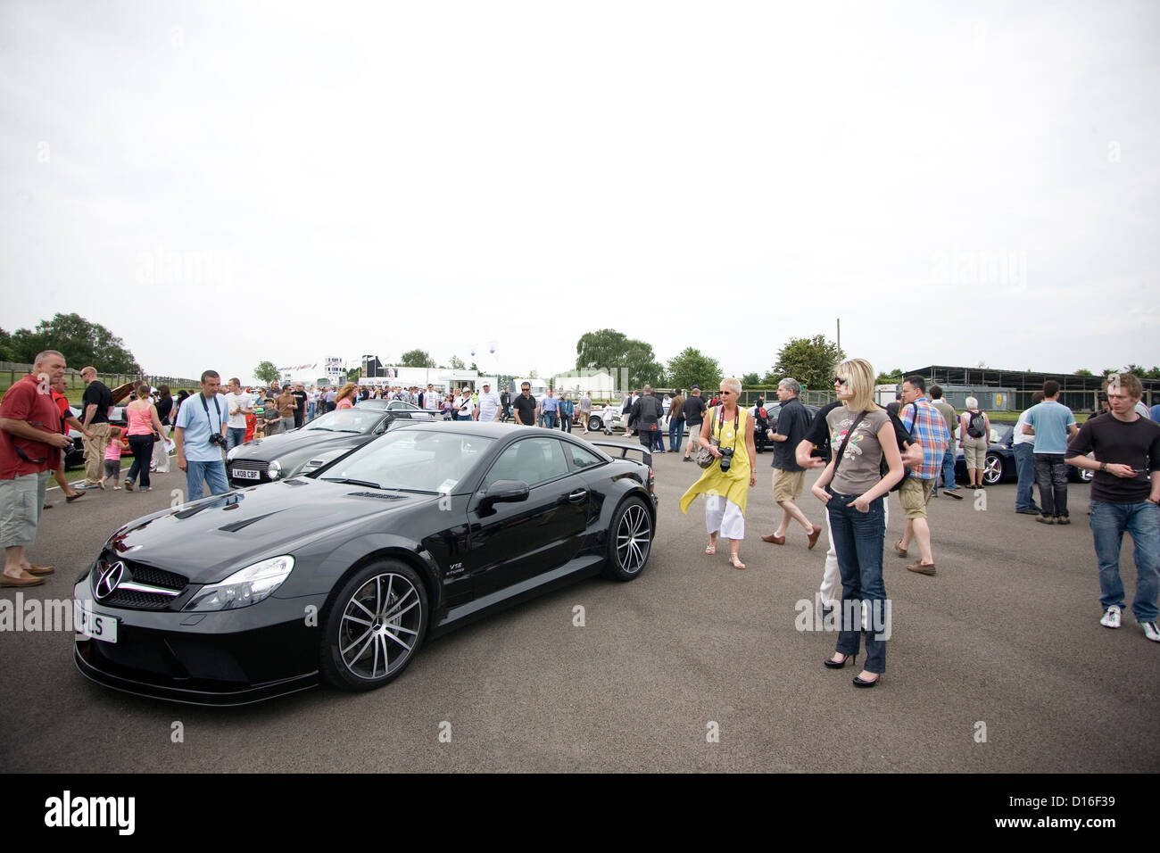 Crowds of people at a car show looking at the cars Stock Photo - Alamy