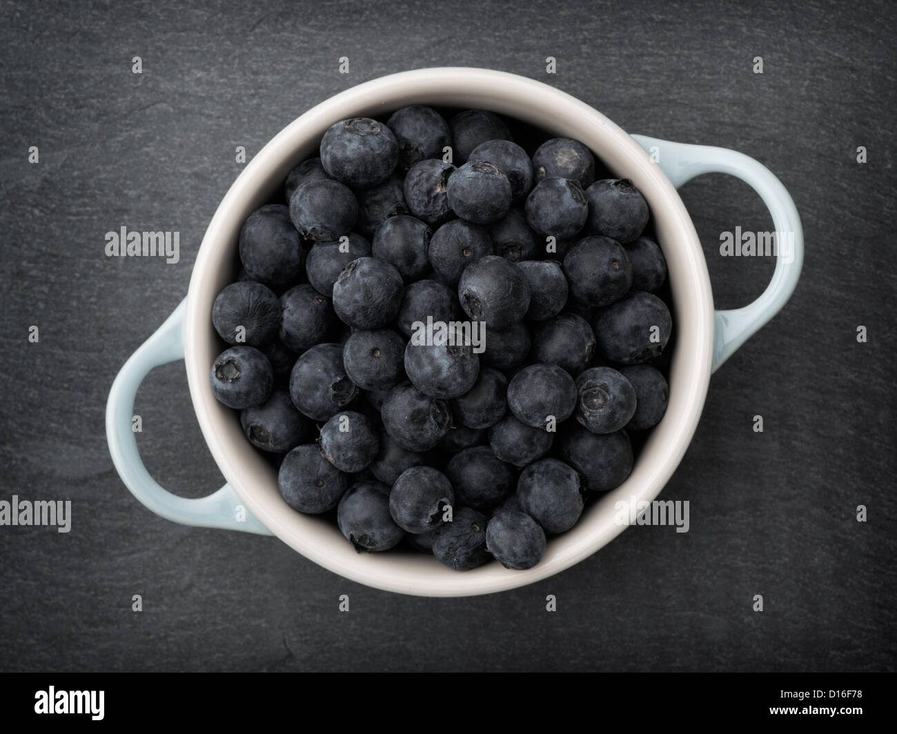 A bowl of blueberries viewed from above on a slate background Stock ...